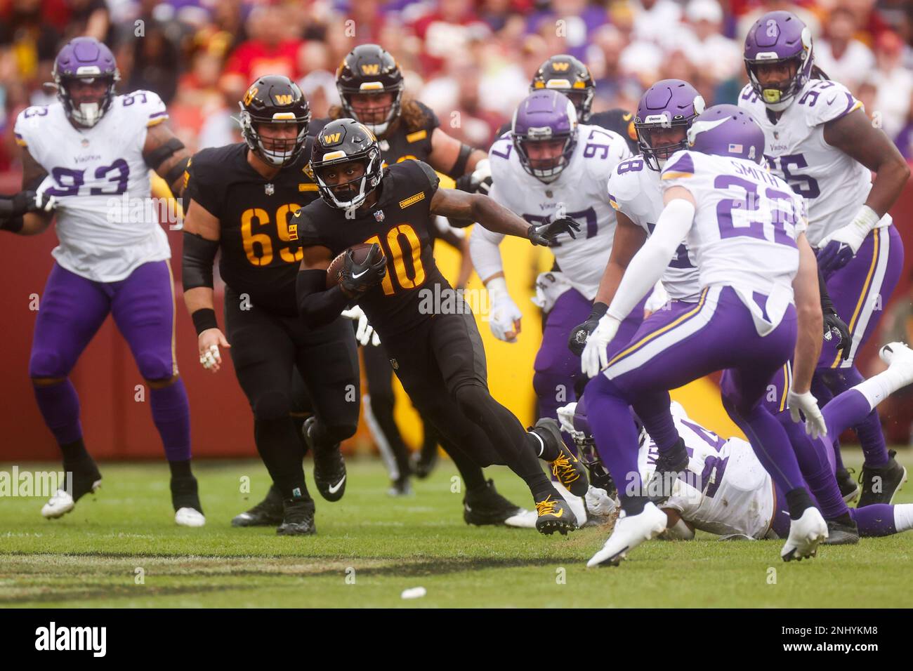 Washington Commanders wide receiver Curtis Samuel (10) carries the ball ...