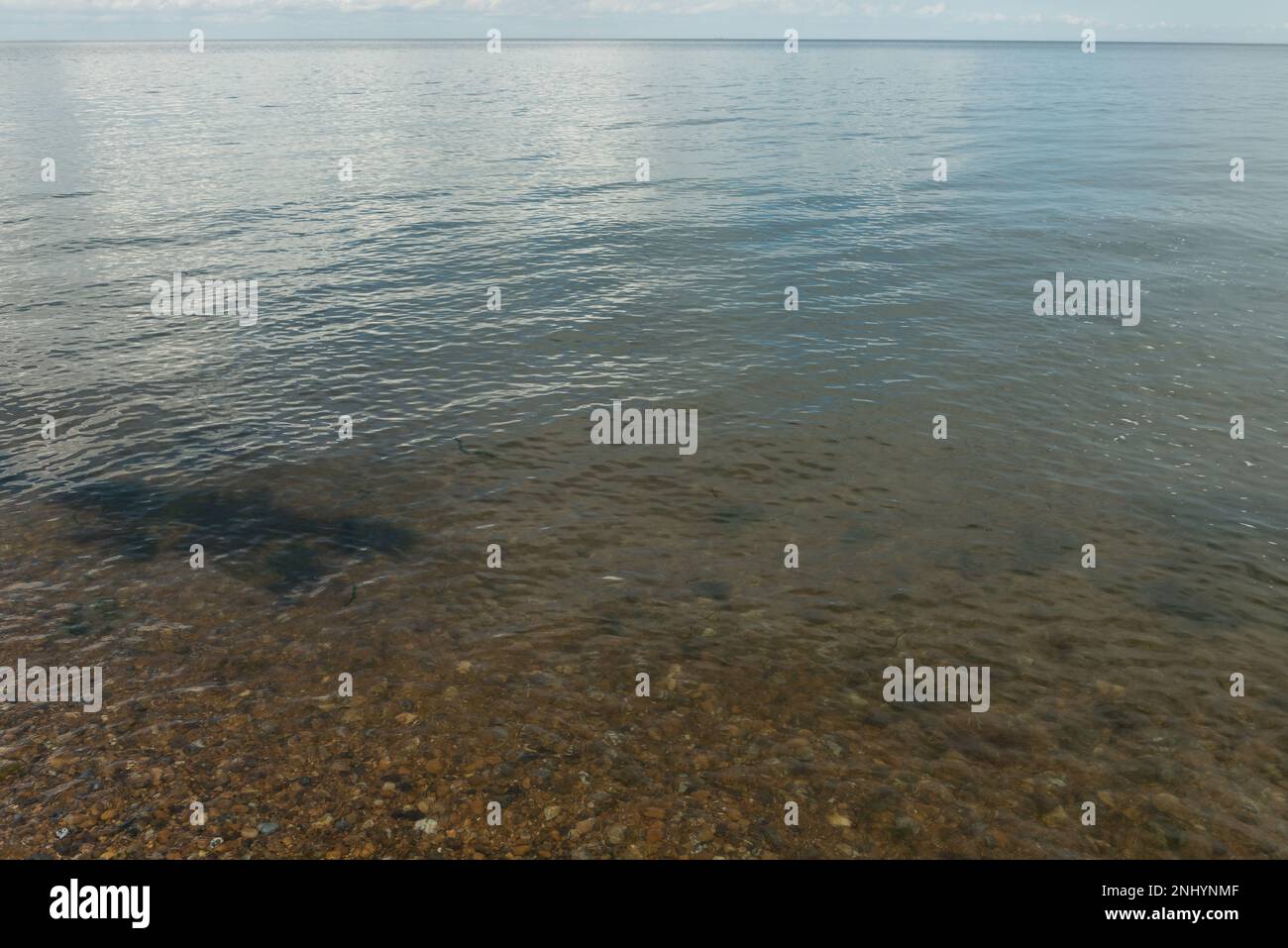 Calm water sea high tide predominates as change of low weather front ...