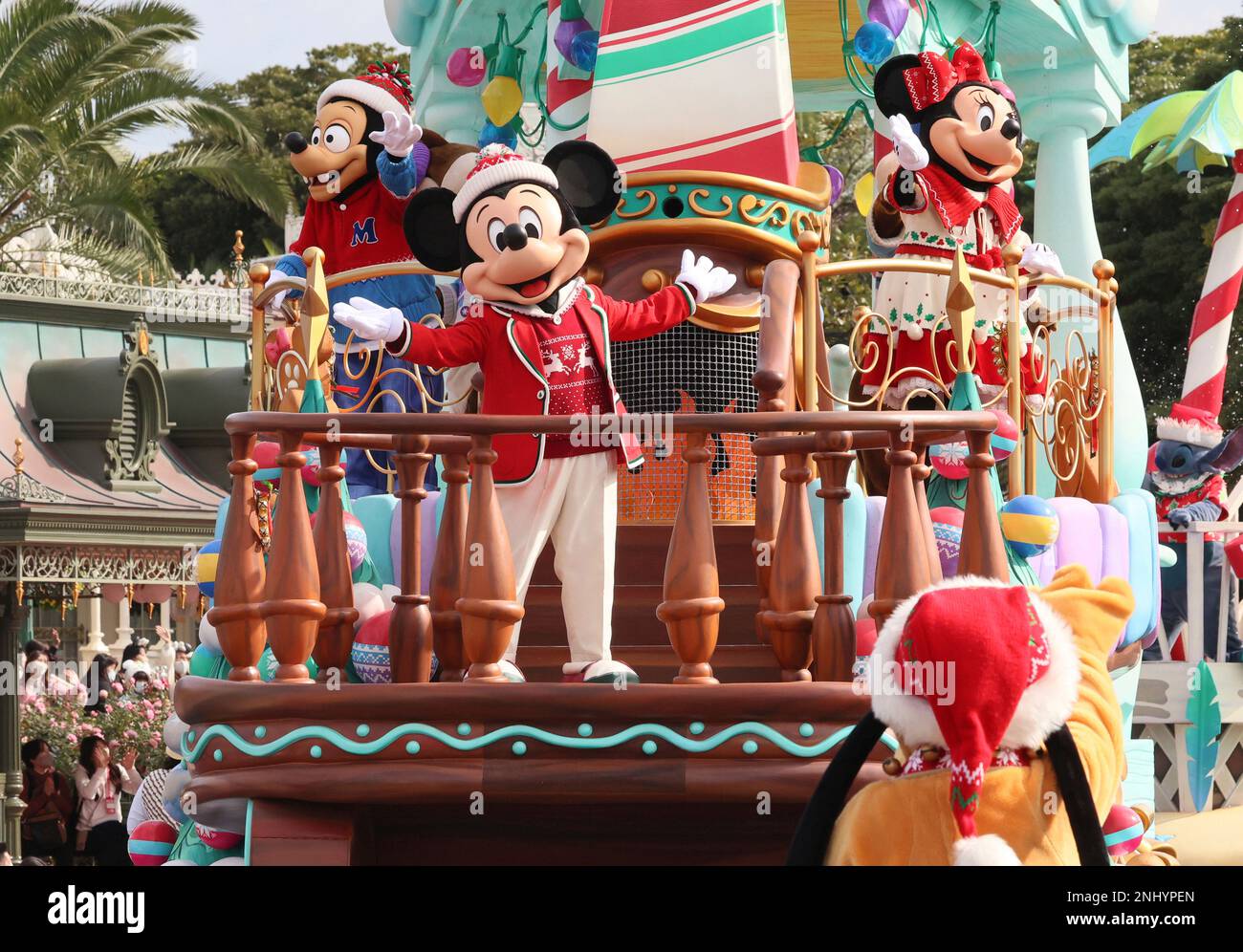 Disney characters Mickey and Minnie Mouse perform on a float for a ...
