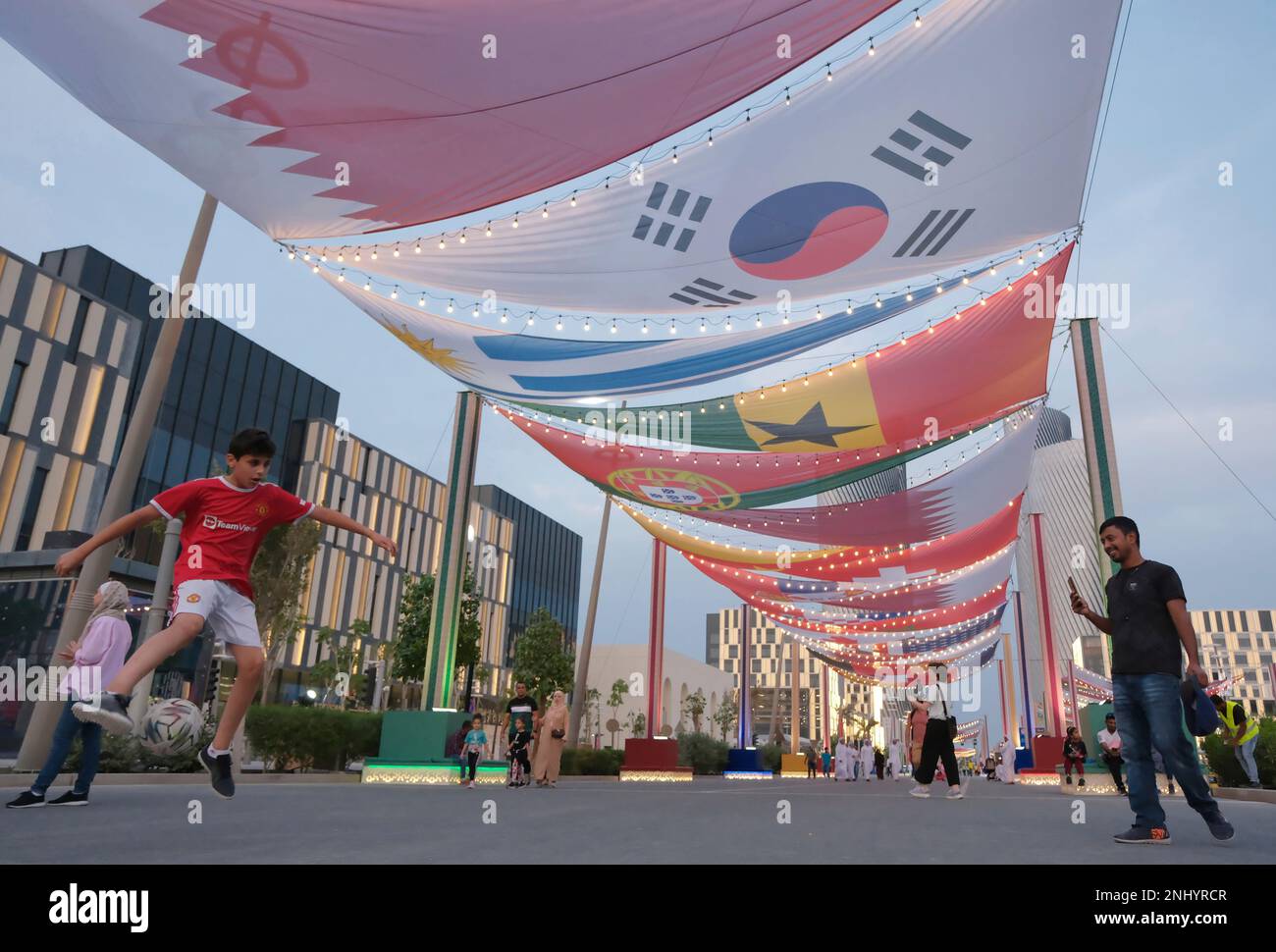 Lusail street is decorated with the national flags of the countries ...