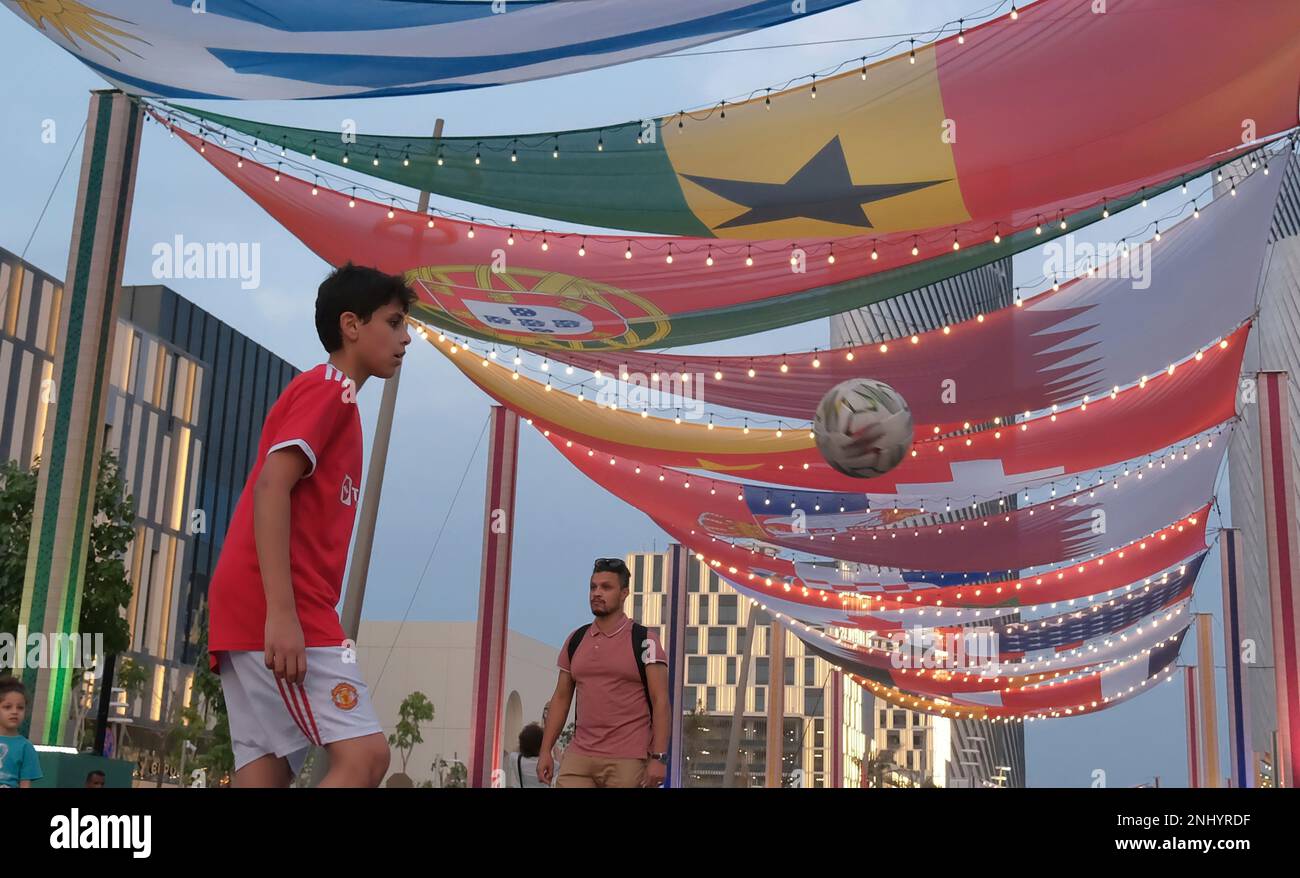 Lusail street is decorated with the national flags of the countries ...