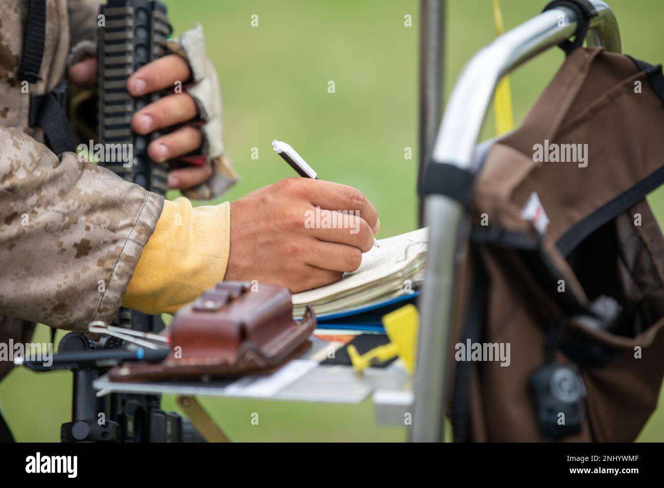 A Marine with the Marine Corps Shooting Team marks a shotpoint during ...