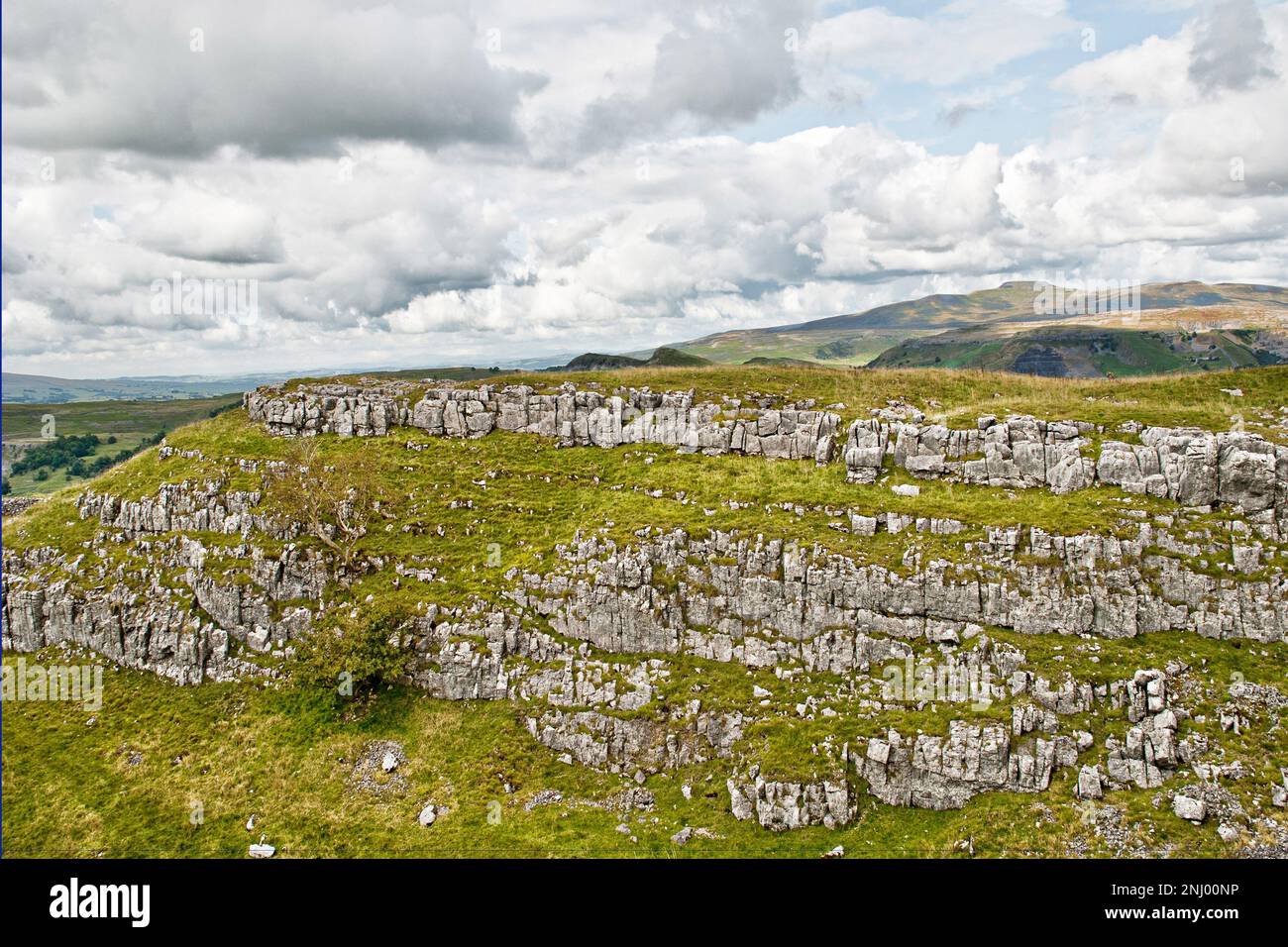 Ingleborough, one of 'The Three Peaks', set in scenic limestone country ...