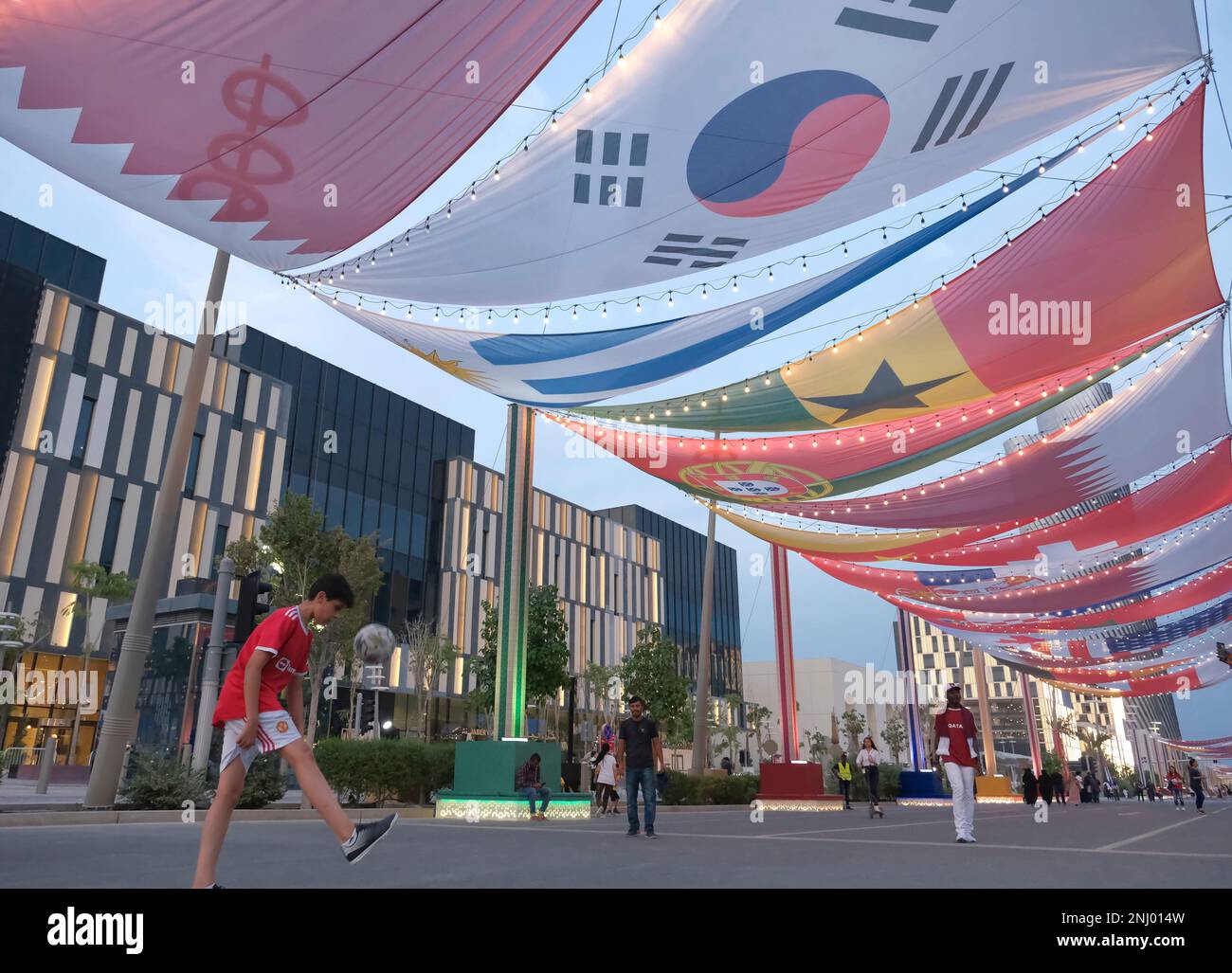 Lusail street is are decorated with the national flags of the countries ...