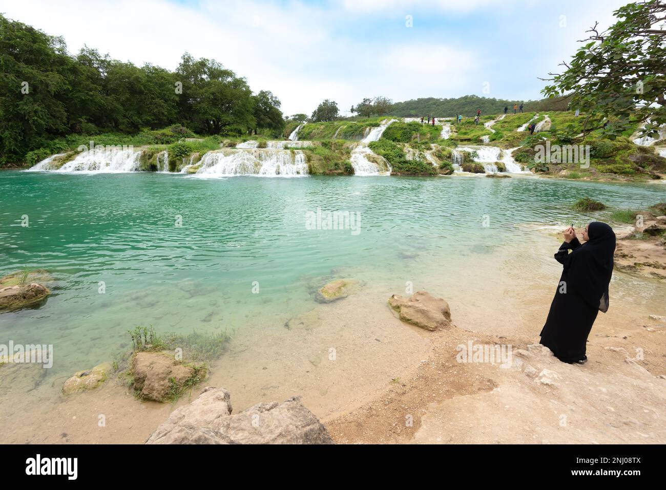 Muslim Woman on Holiday at Darbat Park during the monsoon season of ...
