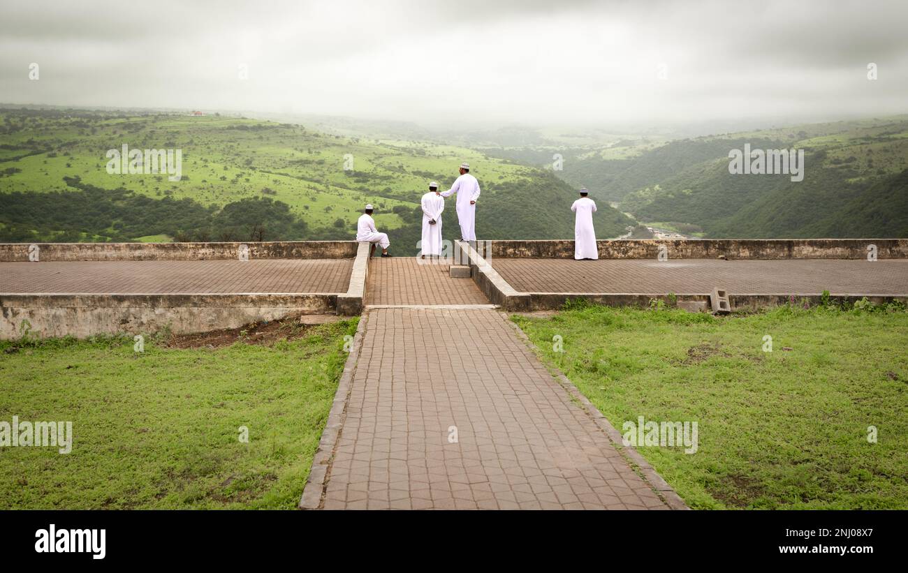 Arab Omani Men overlooking Wadi Darbat during Monsoon season in Salalah ...