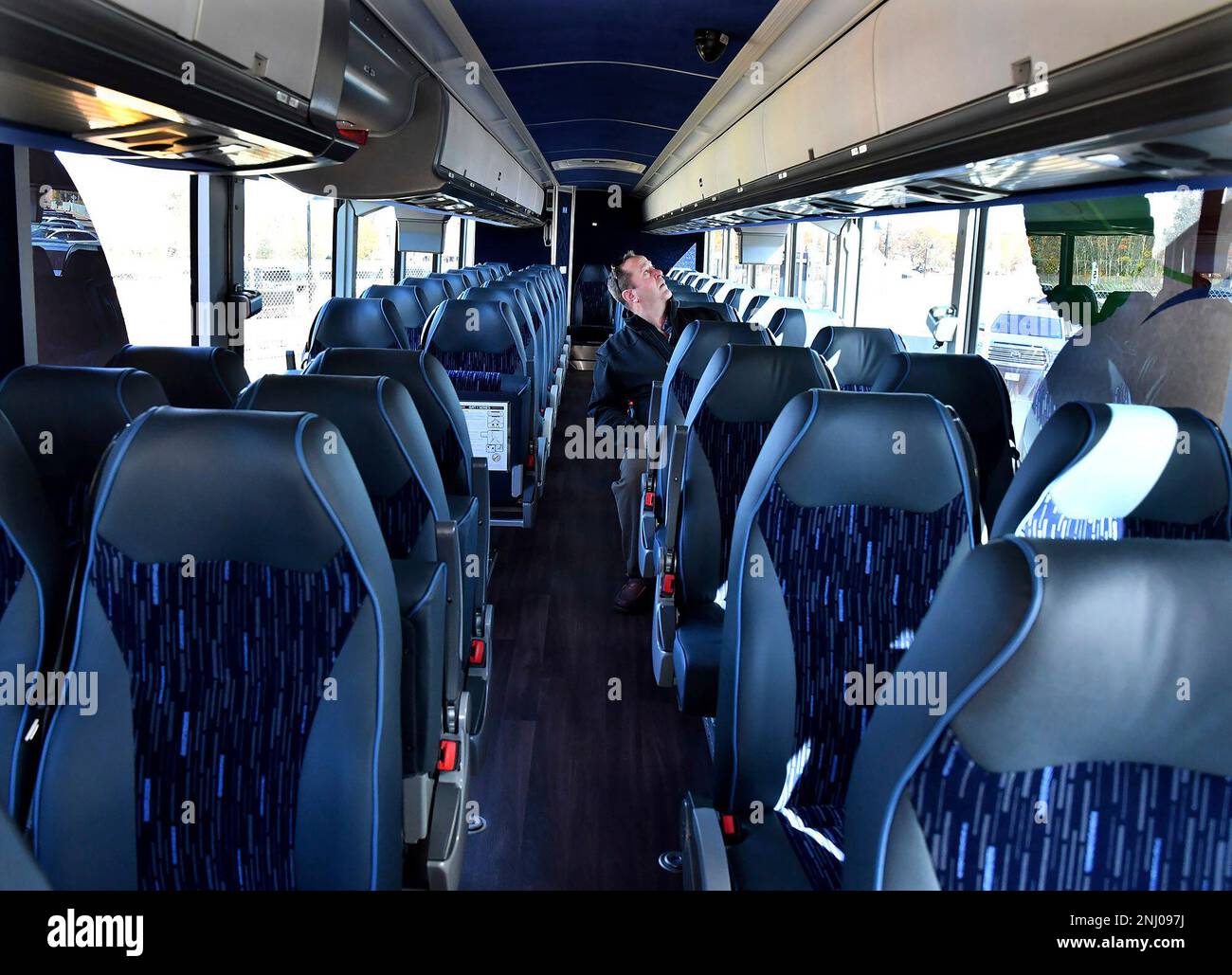 Mansfield Board of Selectmen chair Michael Trowbridge looks over the ...