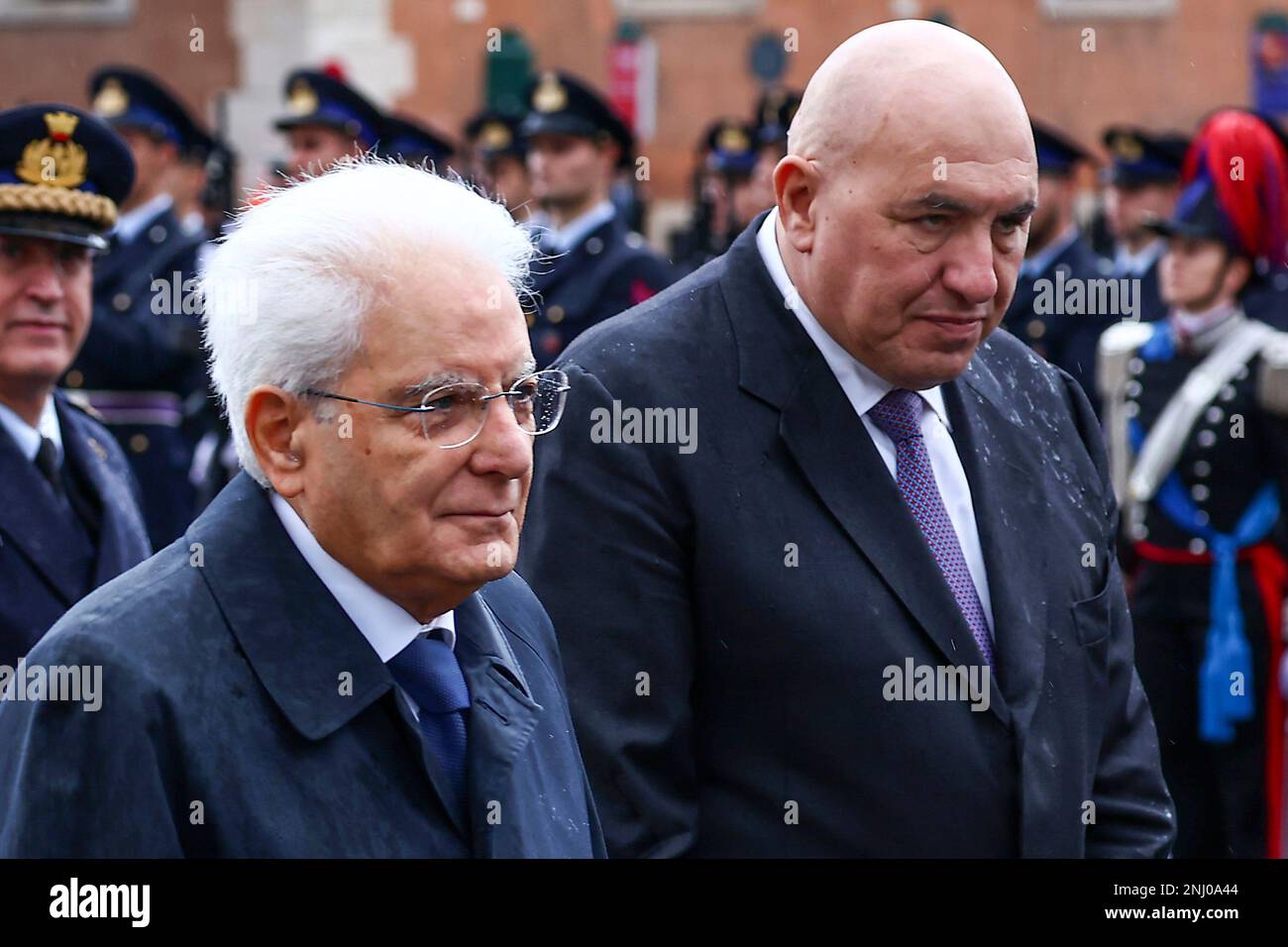 Italian President Sergio Mattarella, left, walks with Italian Minister ...