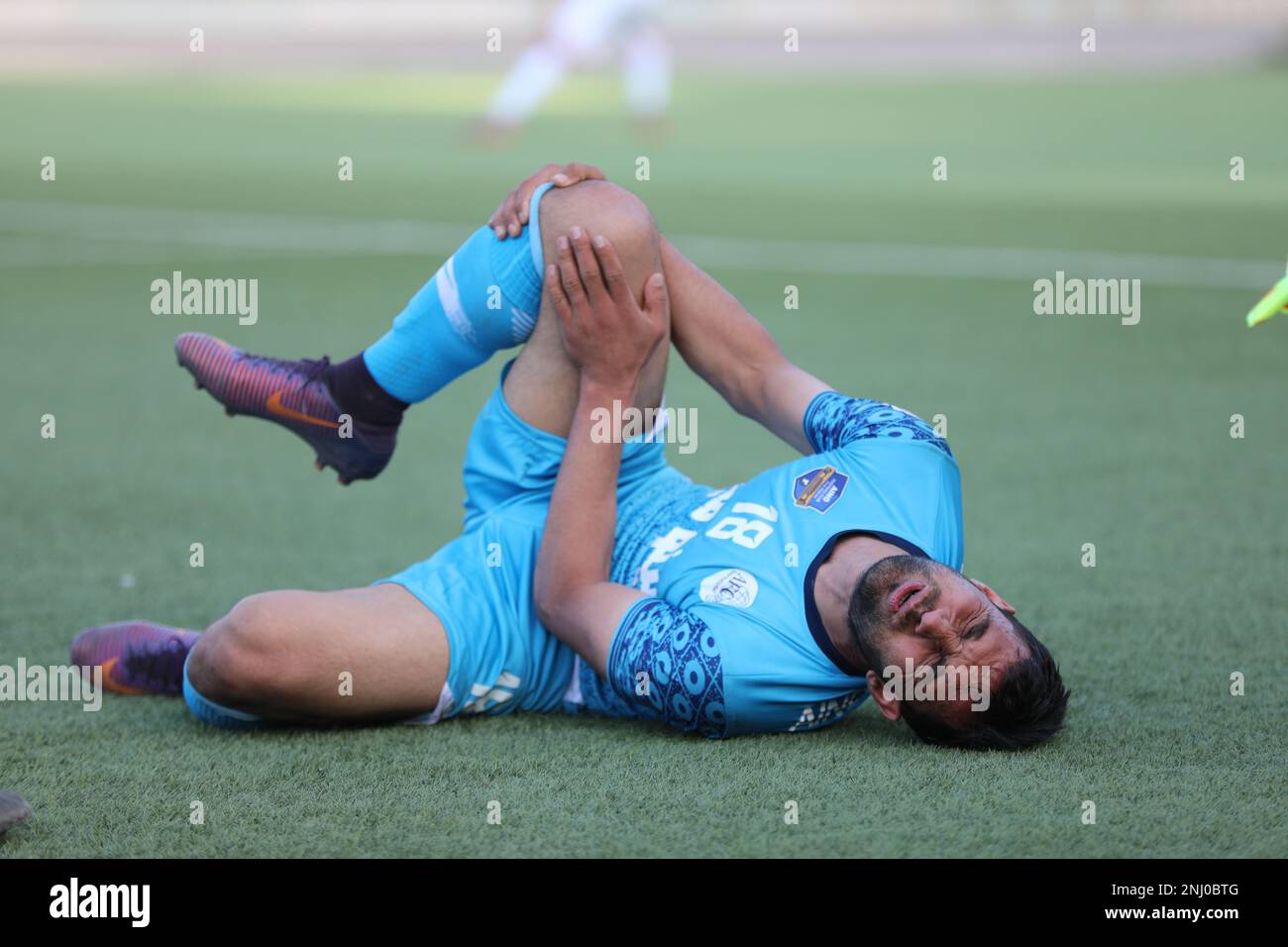 An Afghan Local player suffering leg injury during a game in ...