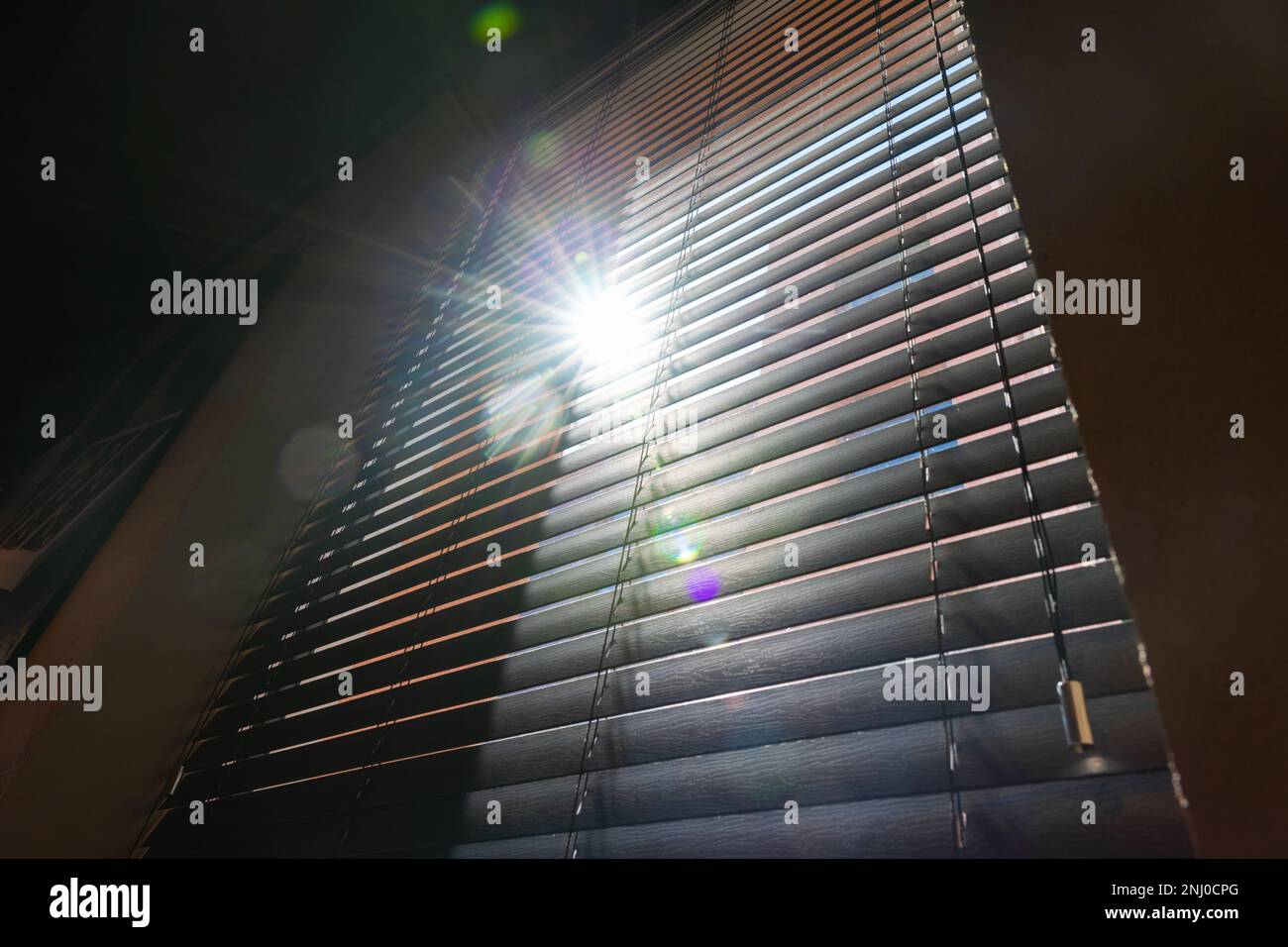 Window blinds or jalousies with direct sunlight. Interior design ...