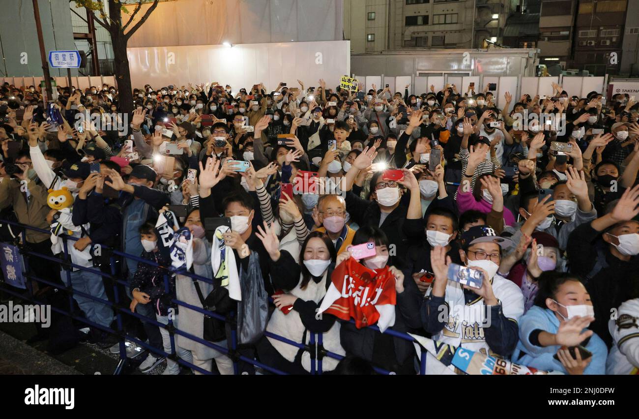 People gather to see ORIX Buffaloes parade on Midosuji in Osaka City, Osaka Prefecture on ...