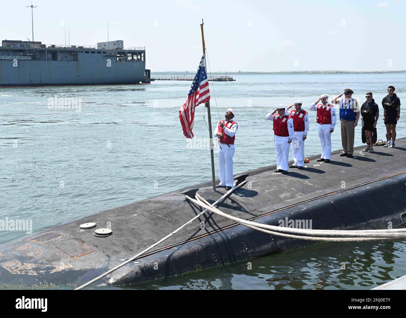 Sailors aboard the Virginia-class fast-attack submarine USS John Warner ...