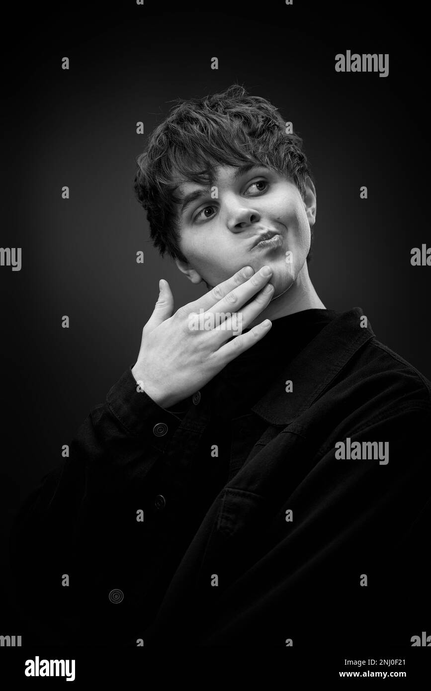 Young handsome businessman standing arms Black and White Stock Photos ...