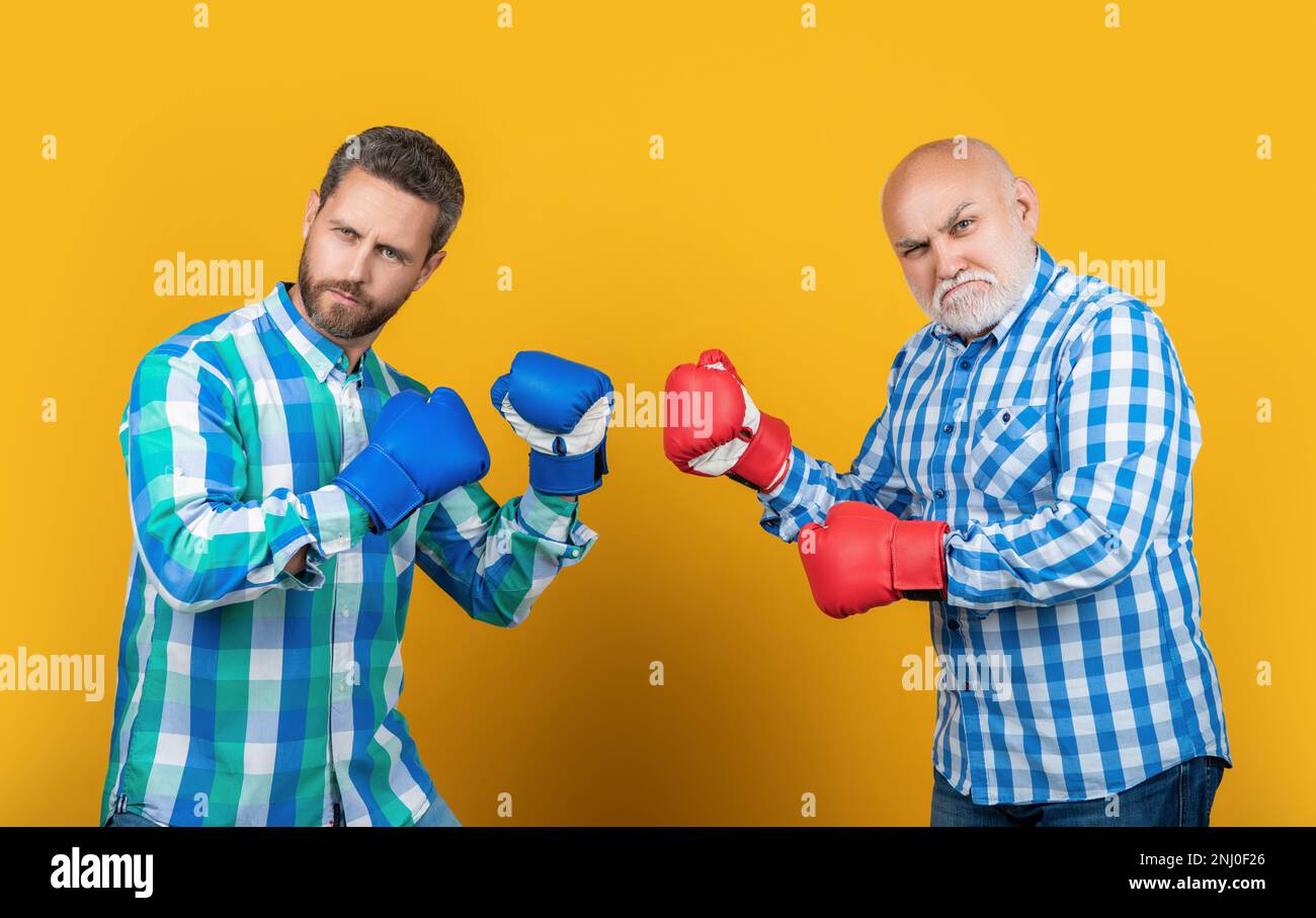 image of generation men fighting wear boxing gloves. two generation men ...