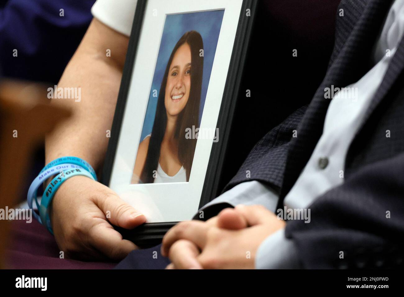 Lori Alhadeff holds a picture of her daughter during the sentencing ...