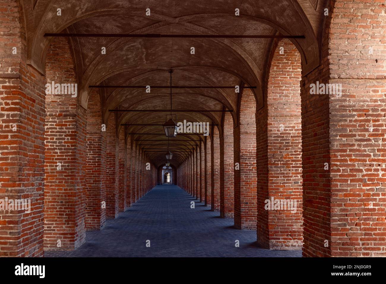 Red brick columns and arches in Galleria degli Antichi in Sabbioneta ...