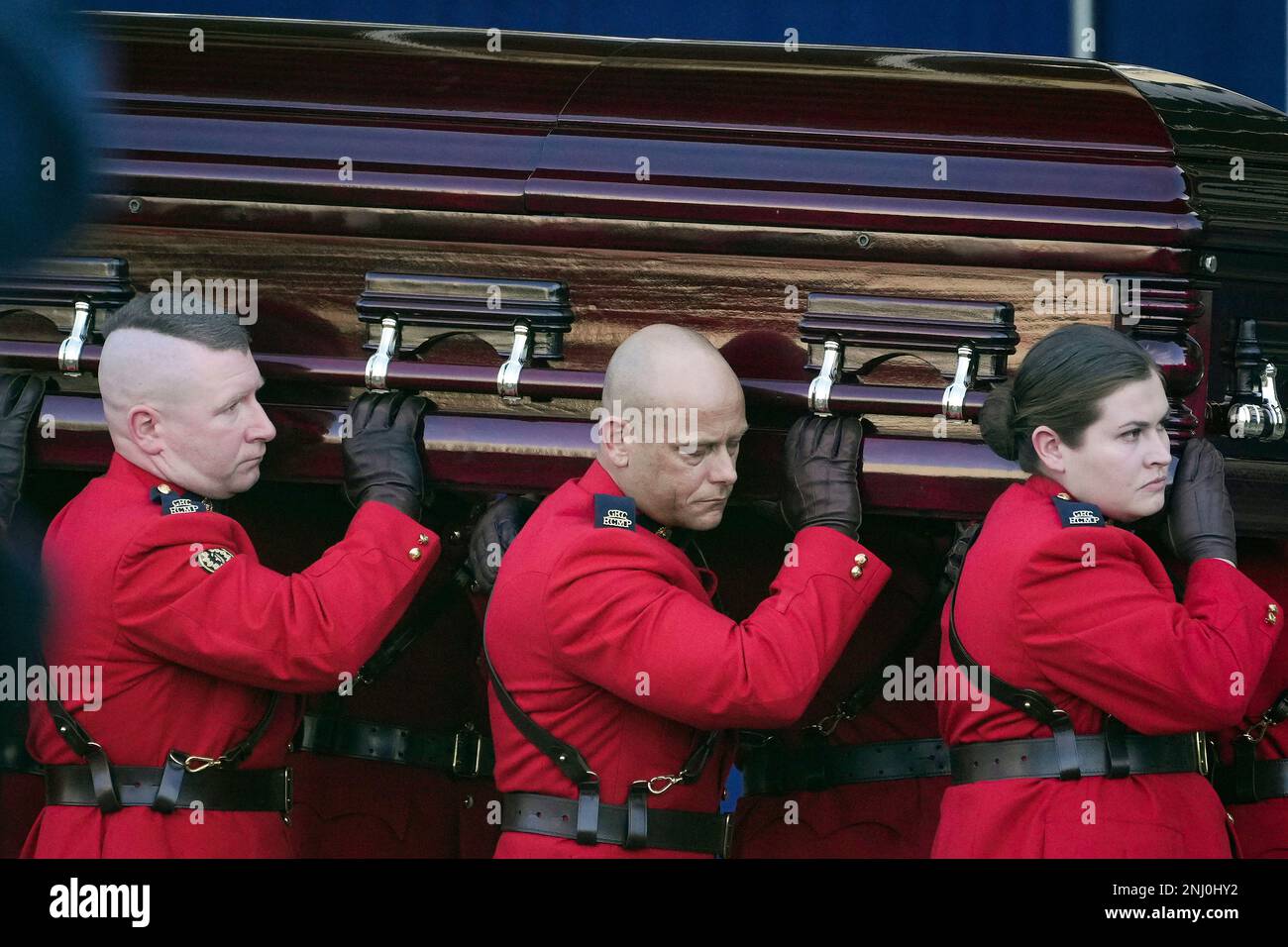 Royal Canadian Mounted Police pallbearers carry the casket of RCMP ...