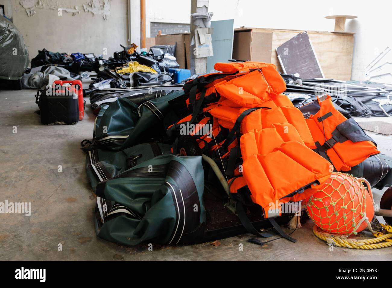 Confiscated goods and motors of boats pictured at a press conference ...