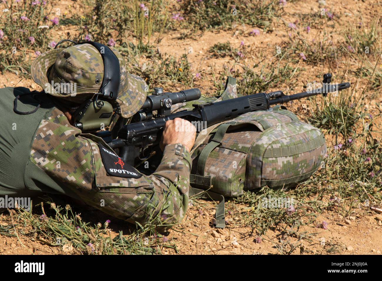 Soldiers fire at targets to zero their rifles during the zeroing phase ...