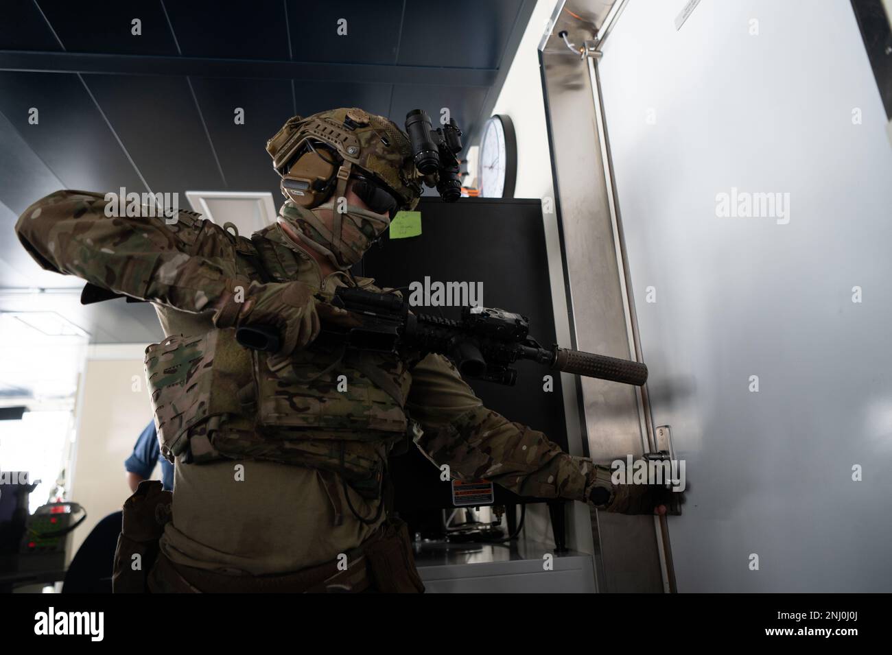 A U.S. Coast Guardsman attached to a Marine Security Response Team ...