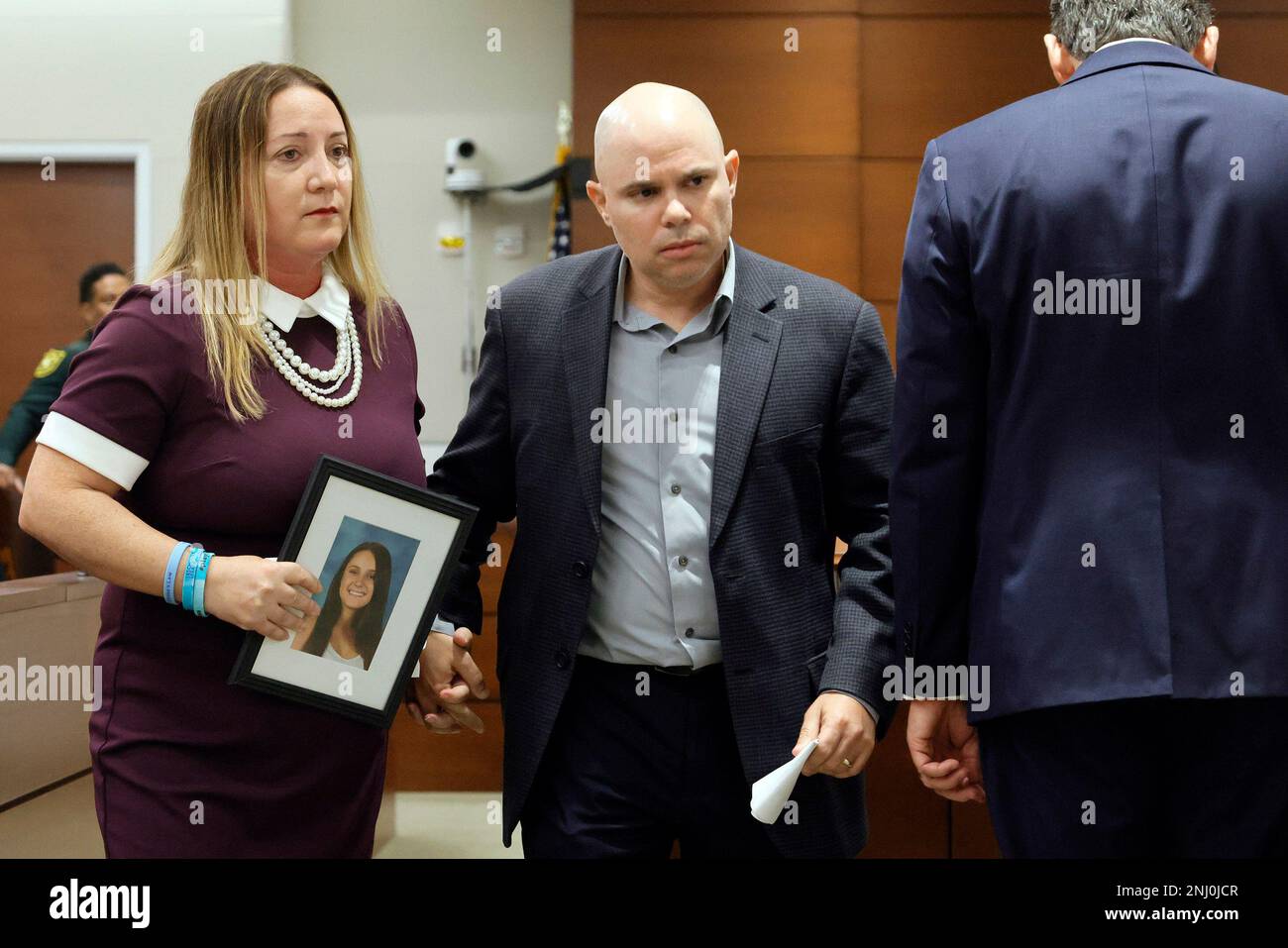 Lori and Ilan Alhadeff leave the podium after giving their victim ...