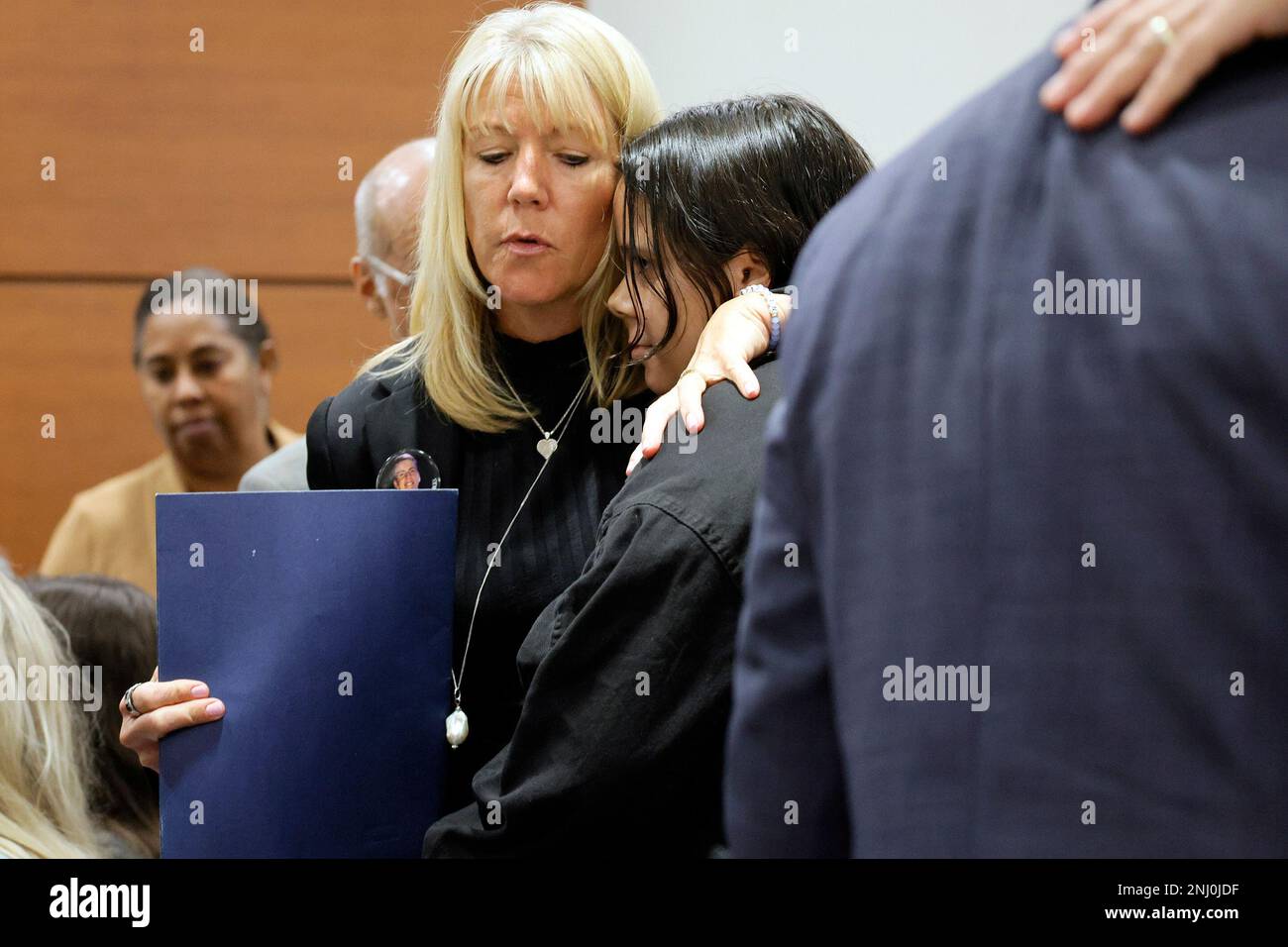 Annika Dworet, left, embraces Sam Fuentes, who was injured in the 2018 ...
