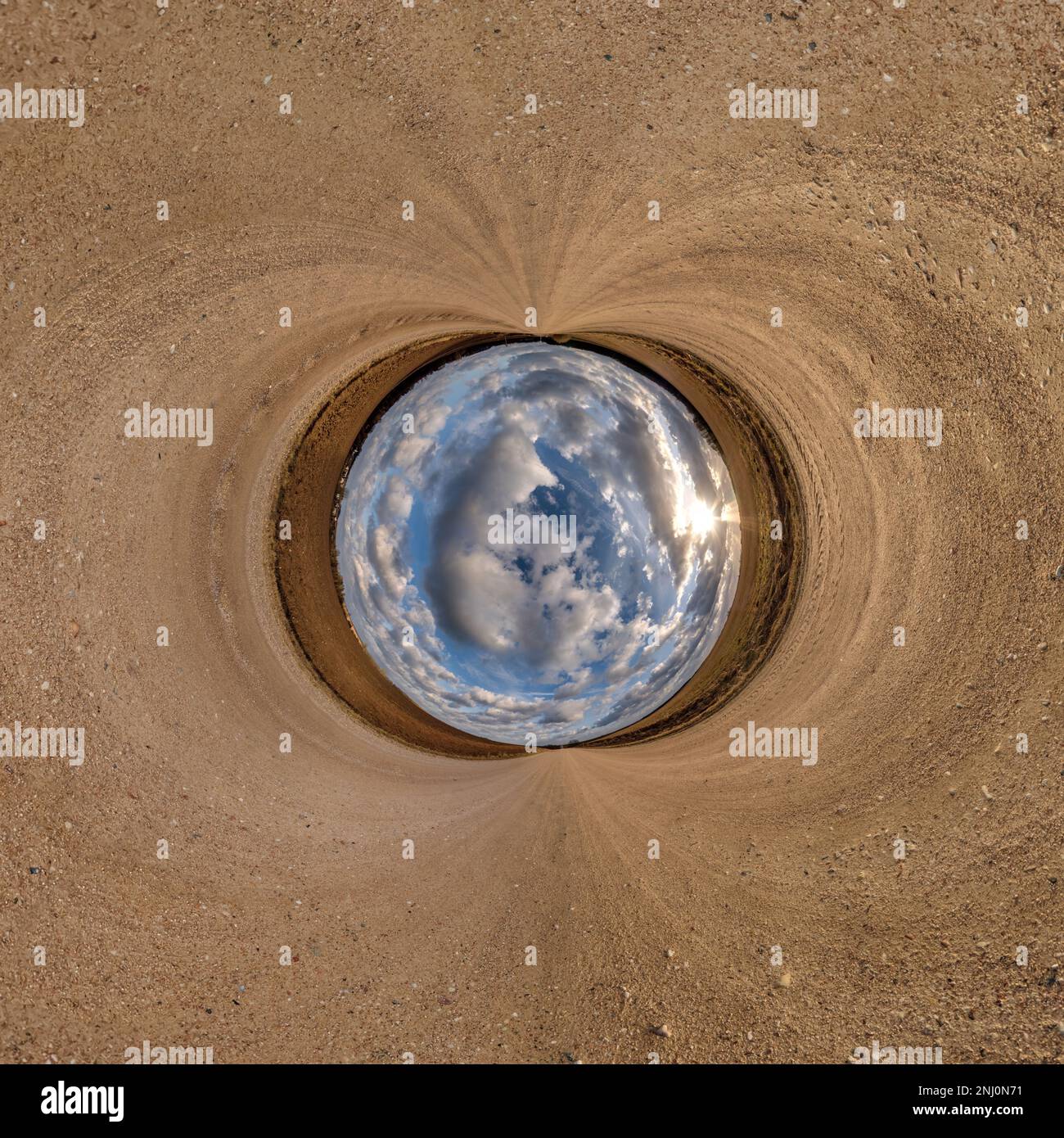blue sphere little planet inside gravel road or field background ...