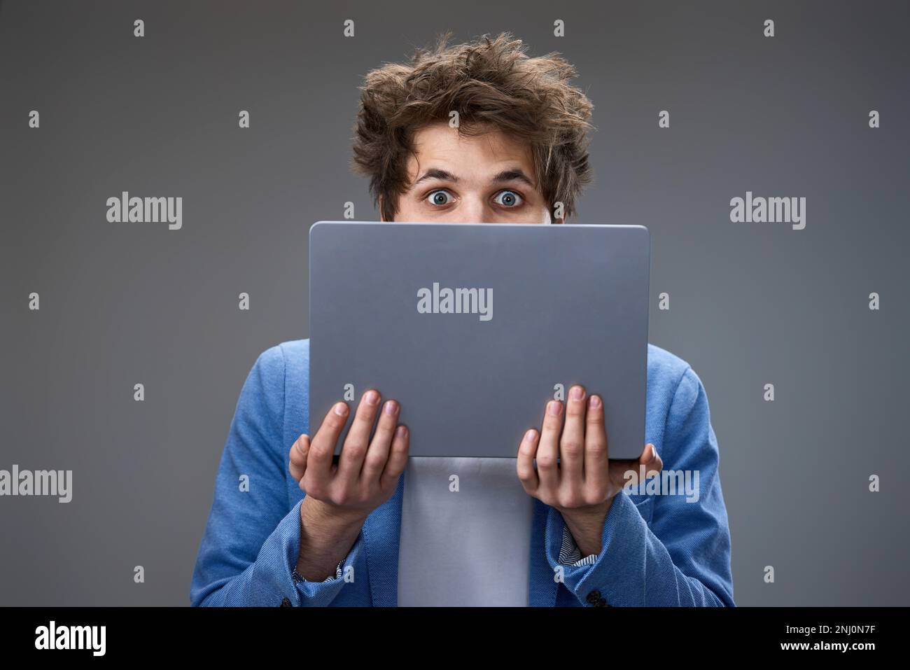 Student hidden behind computer hi-res stock photography and images - Alamy
