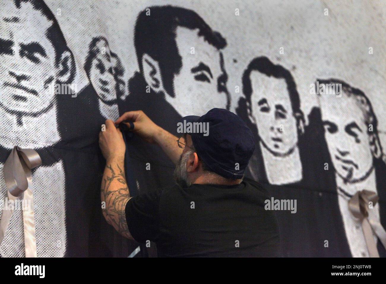 Artist Nayland Blake working on his recreated mural by Chuck Arnett ...