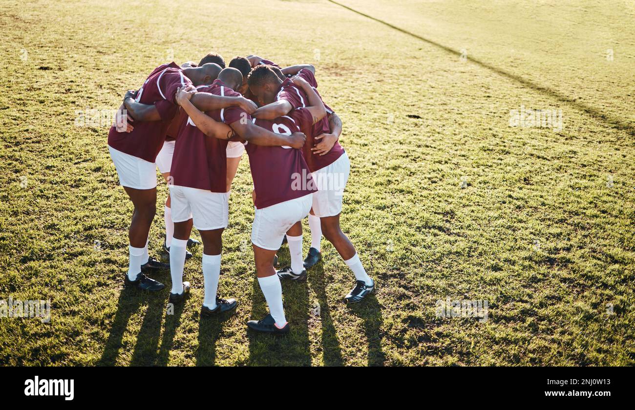 Man, huddle and team on grass field for sports motivation, coordination or collaboration in the ...