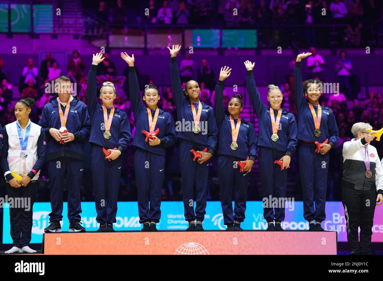 US team members celebrate on the podium of WOMEN'S TEAM FINAL at FIG ...