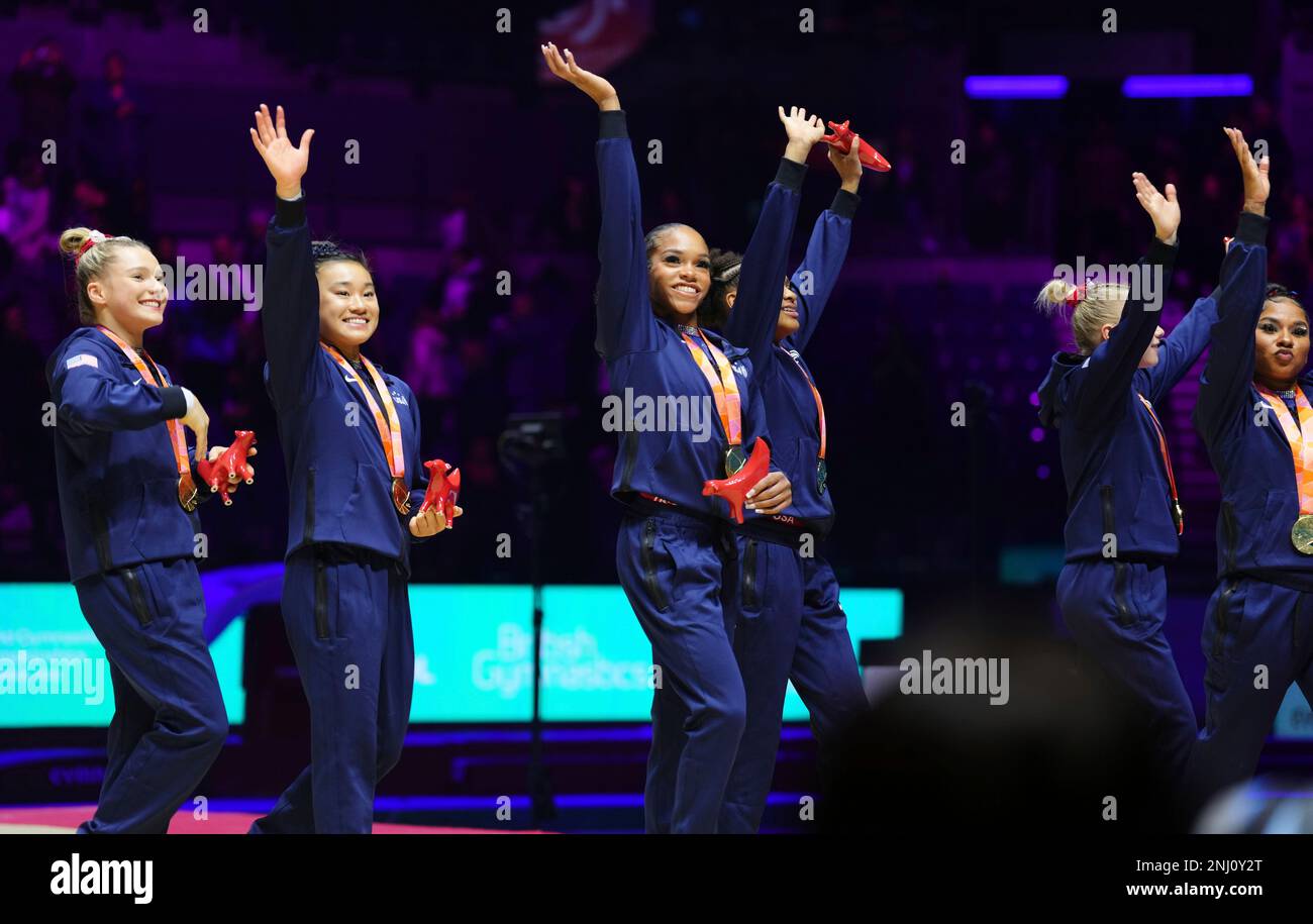 US team members celebrate on the podium of WOMEN'S TEAM FINAL at FIG ...