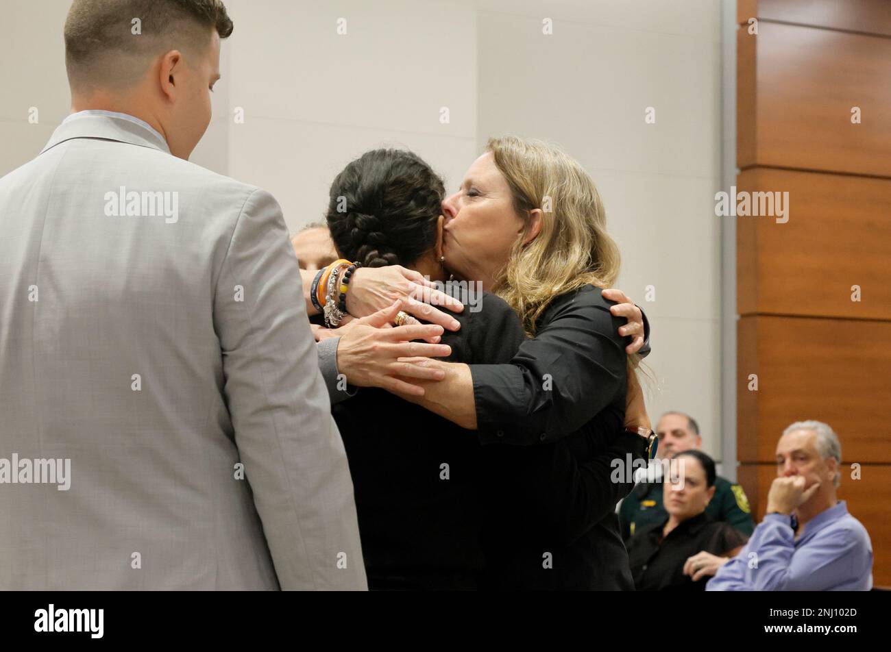 Debbie Hixon, right, kisses her daughter-in-law, Ines Hixon, after she ...
