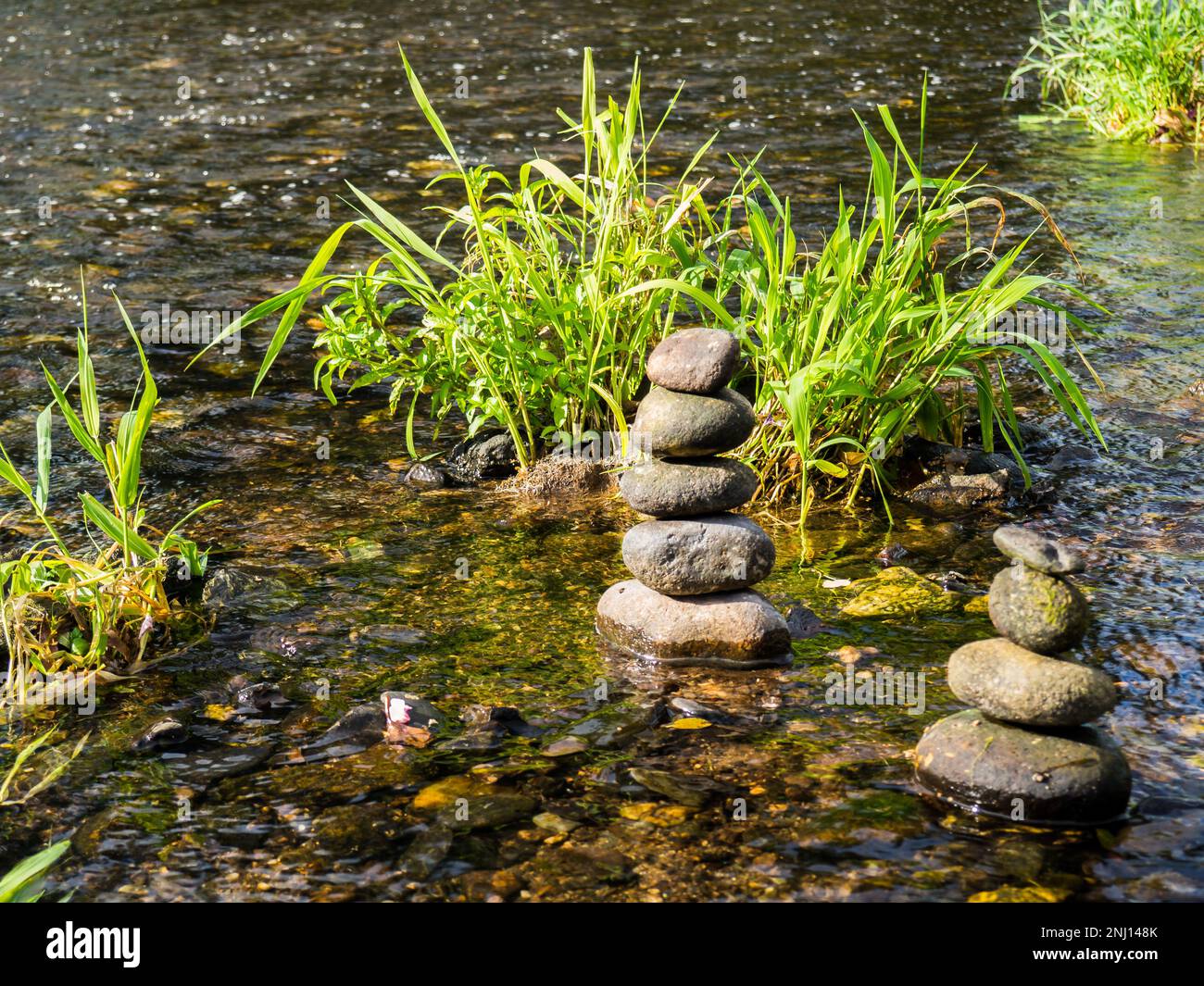 Balance stones in a river 01 Stock Photo - Alamy