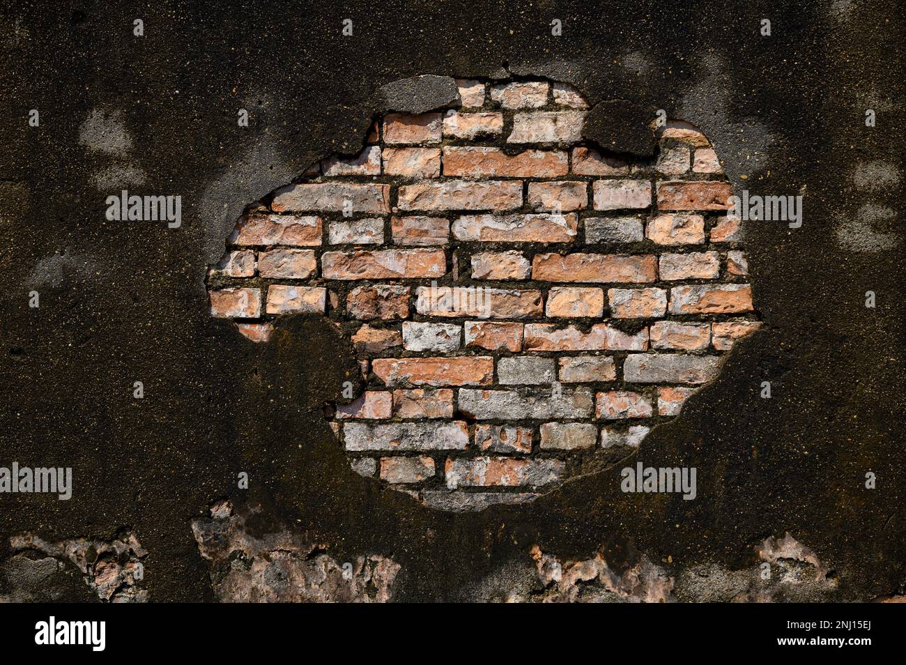 Shabby brick wall with damaged plaster surface Stock Photo - Alamy