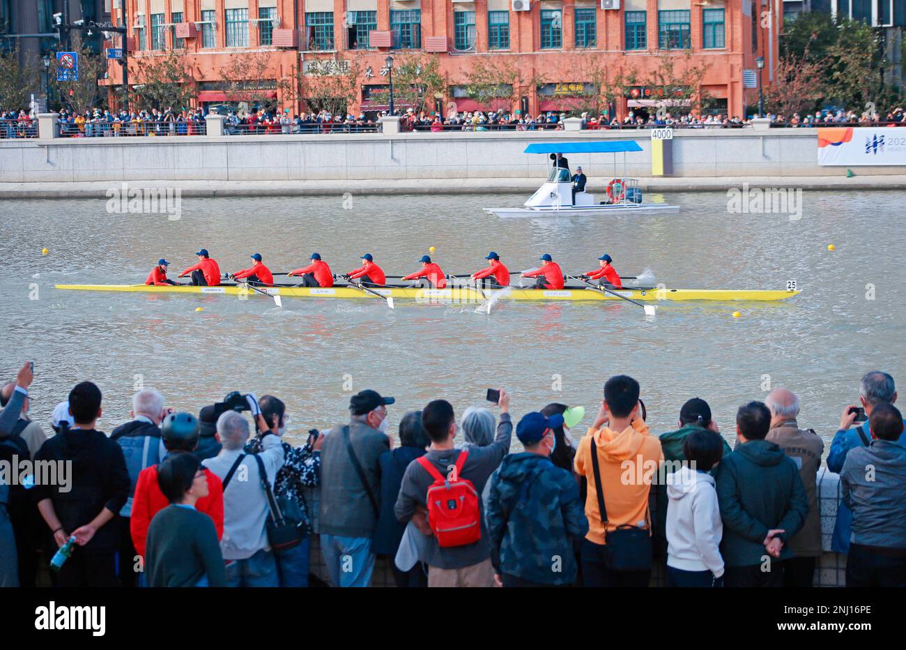 Paddlers compete in a race in the second Head of Shanghai River Regatta ...