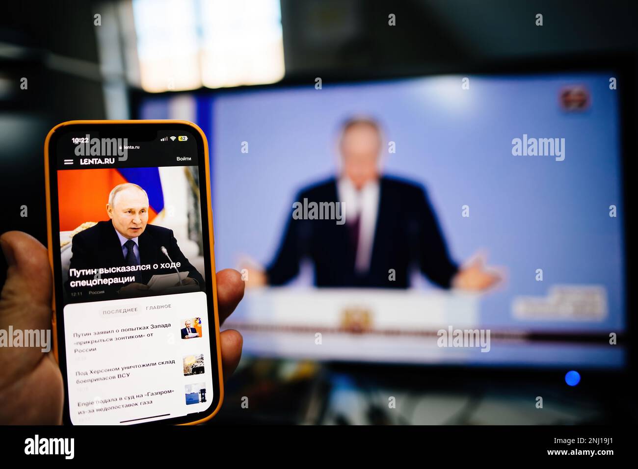 Paris, France - Feb 21, 2023: Man watching on PC Krym 24 station direct ...