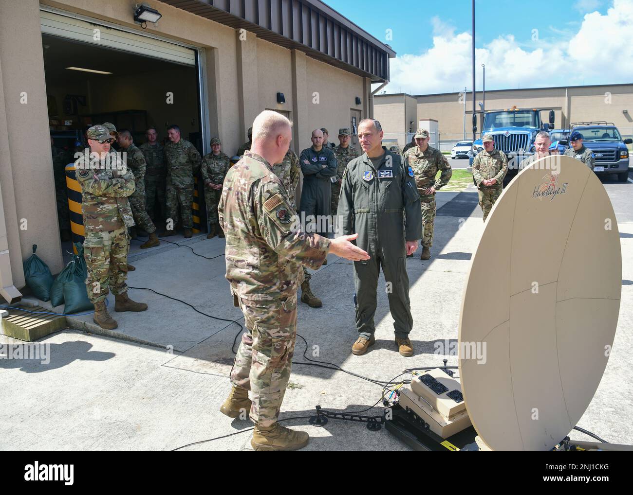 A member of the 8th Communication Squadron briefs Lt. Gen. Scott “Rolls ...