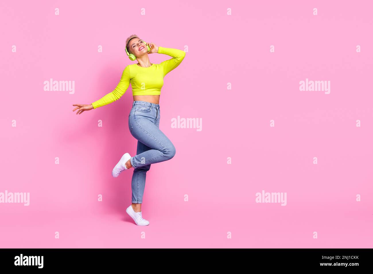 Full body photo of cheerful gorgeous girl stand one leg dancing empty ...