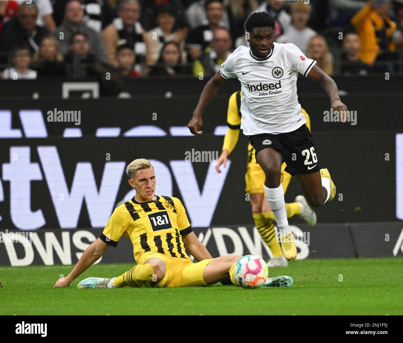 Frankfurt's Eric Junior Dina Ebimbe, right, and Dortmund's Nico ...
