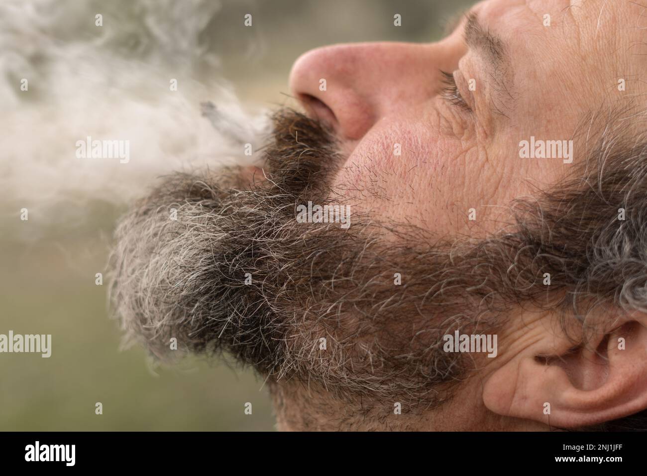 Puffing out smoke hi-res stock photography and images - Alamy