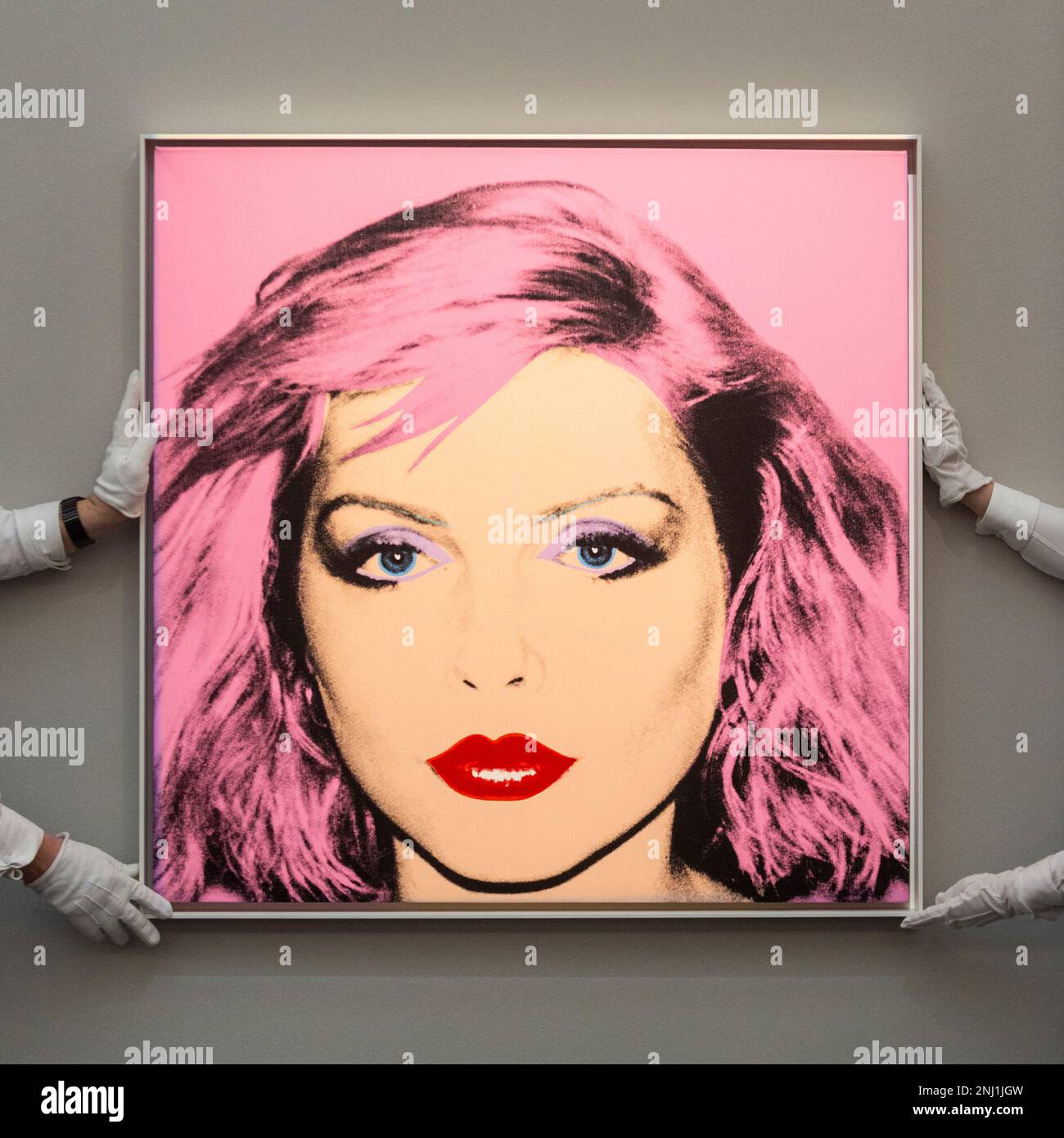 London, UK. 22 February 2023. Technicians present 'Debbie Harry' by Andy Warhol (Est. £4,000,000 ...