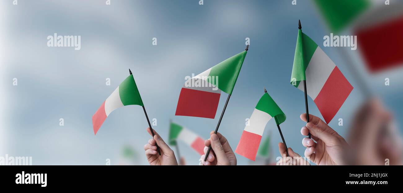A group of people holding small flags of the Italy in their hands Stock ...