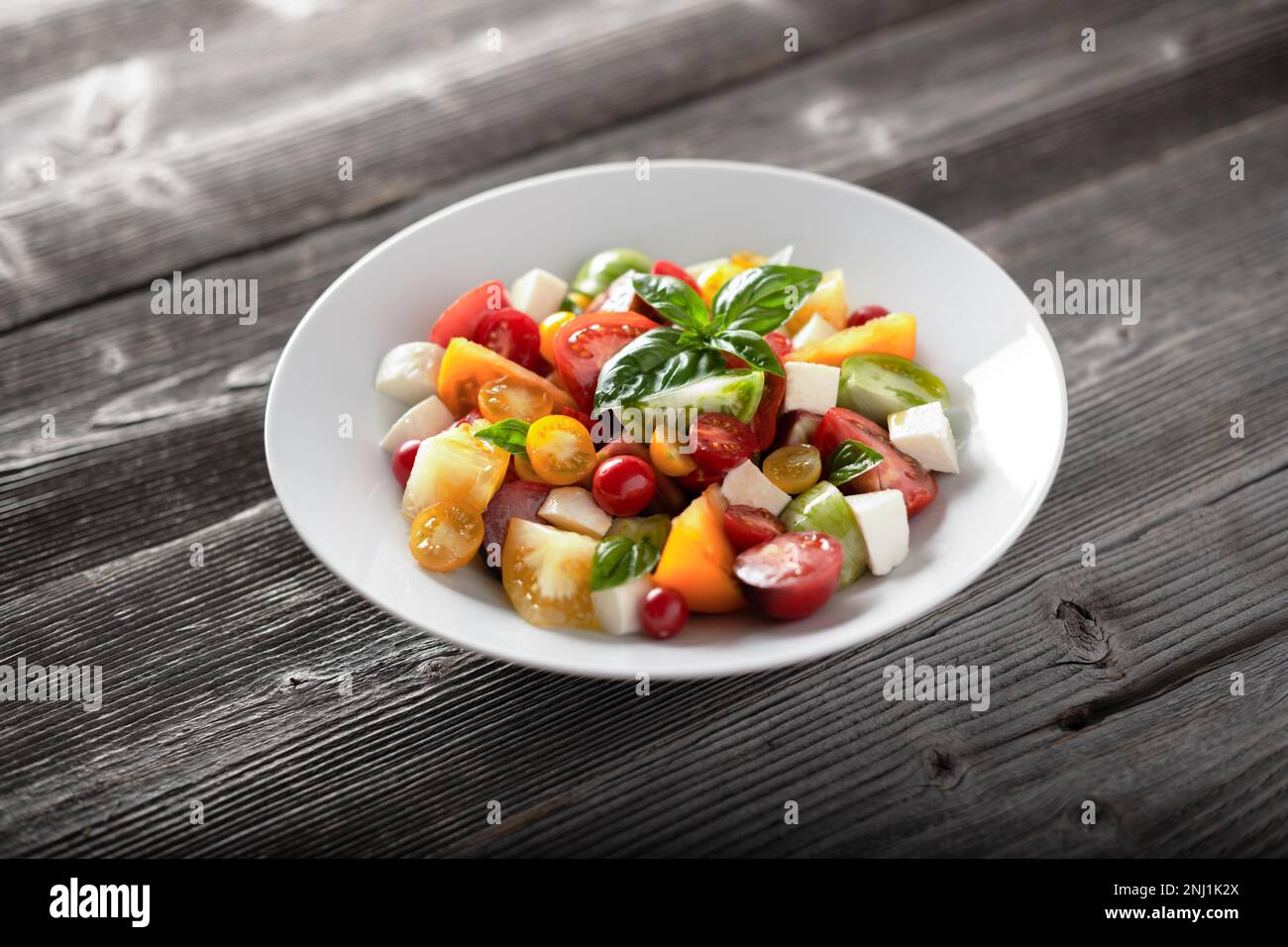 Salad with different varieties kind of red, yellow, green and black ...