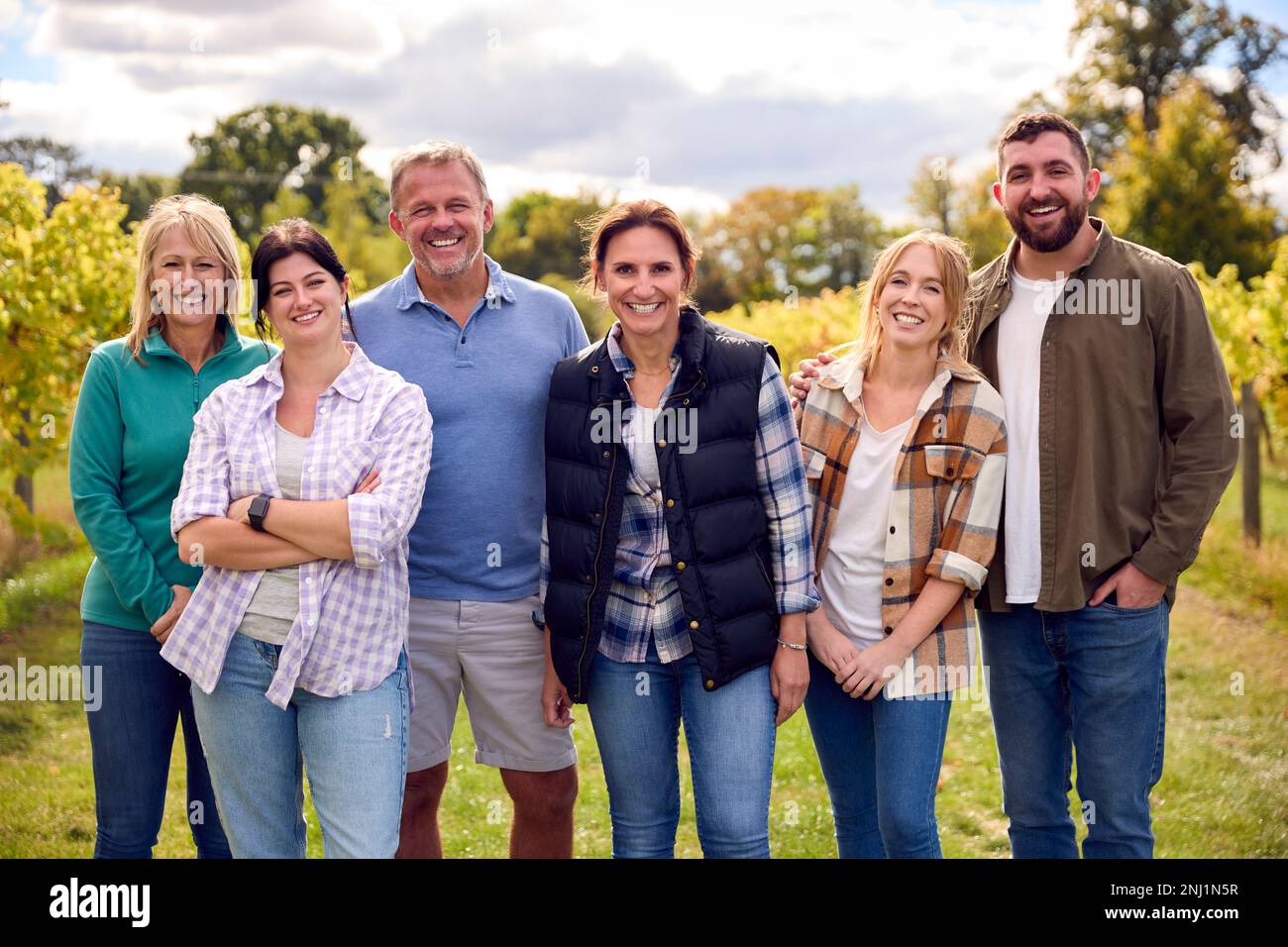 Portrait Of Team Of Graper Pickers At Harvest Working In Vineyard ...