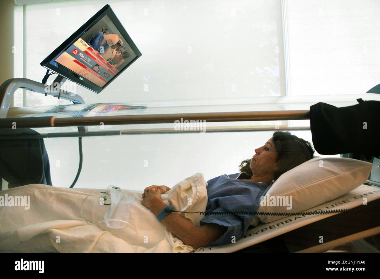 Mimi Roth, 53, from San Mateo receives treatment in the hyperbaric ...