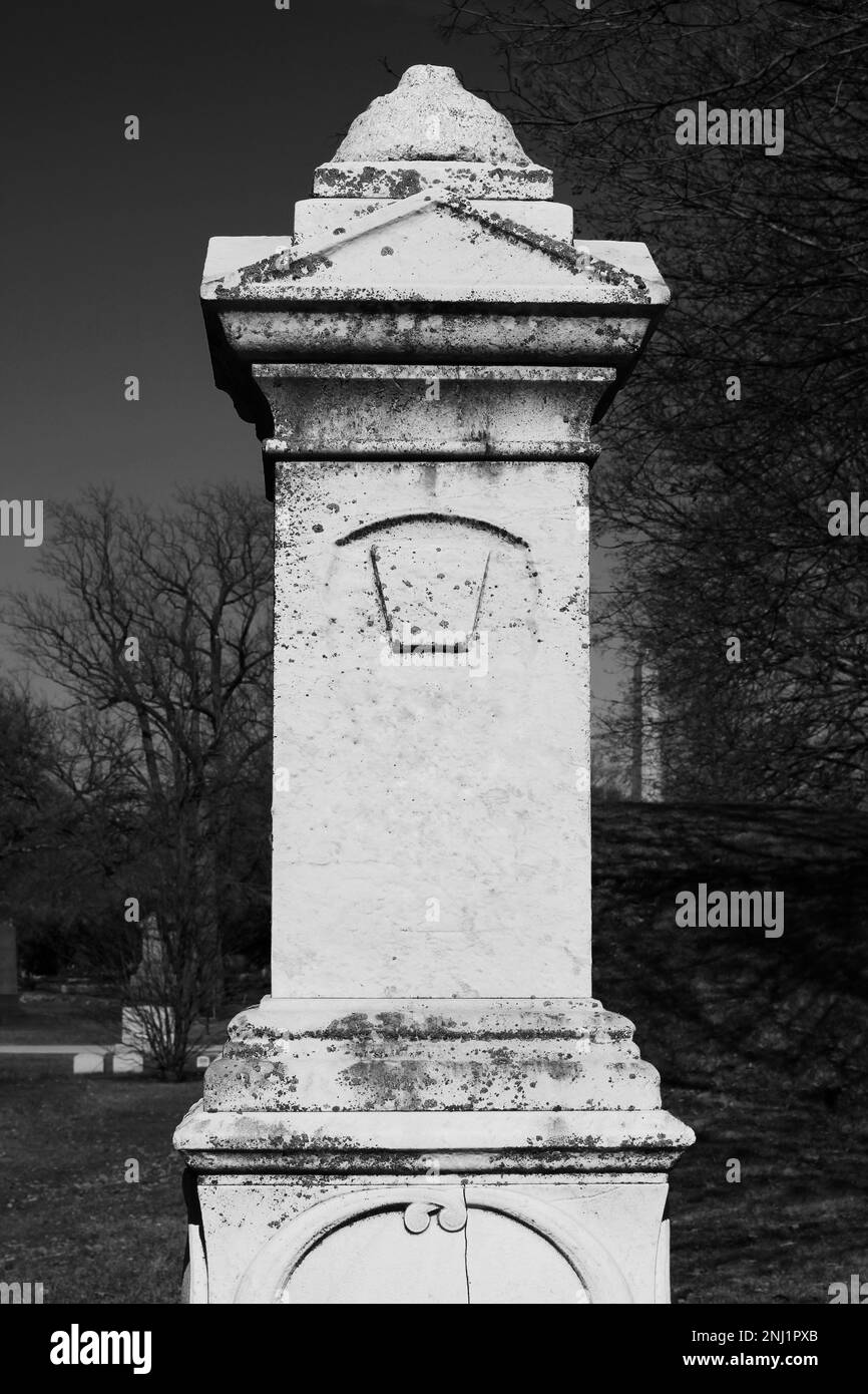 A worn and weathered old tombstone with a blank epitaph and room for ...