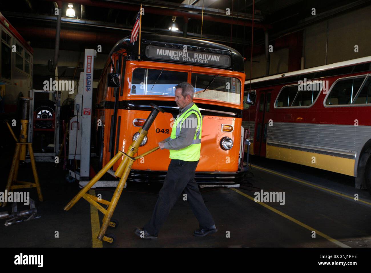 Superintendent of bus maintenance Louis Guzzo shows historic buses ...