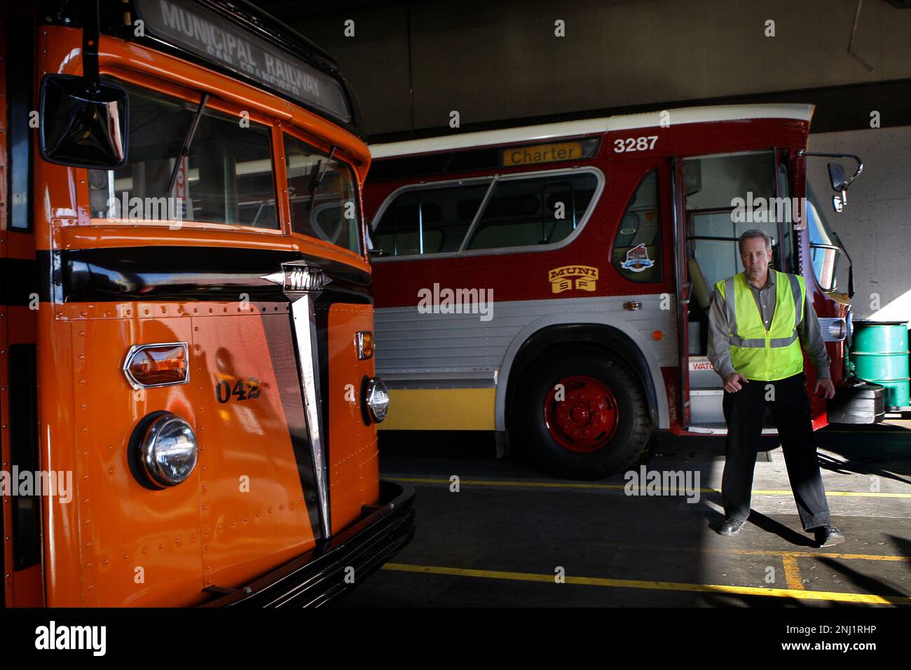 Superintendent of bus maintenance Louis Guzzo shows historic buses ...