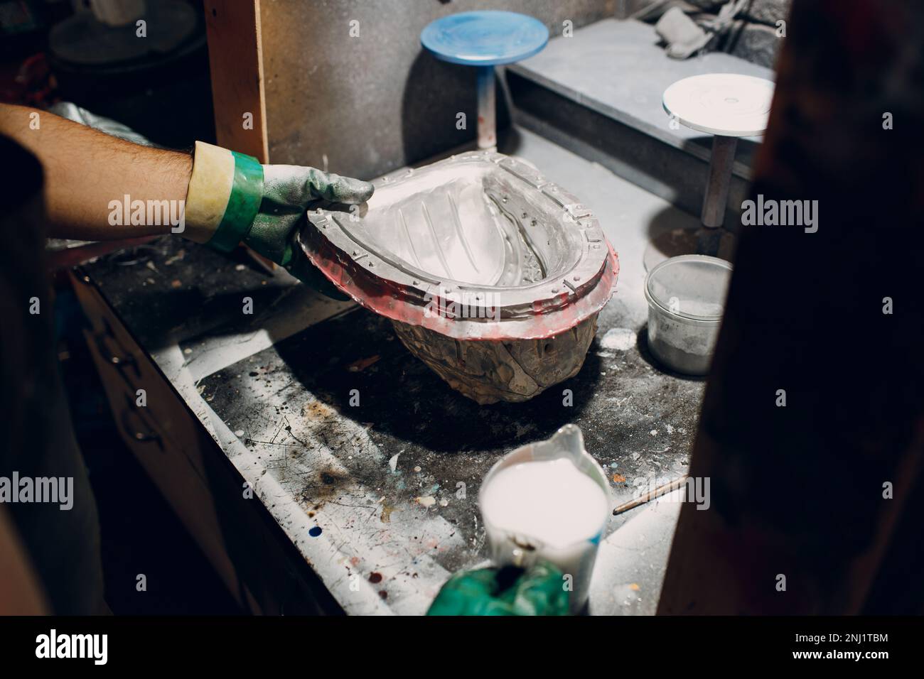 Artisan craftsman create resine plastic mask based on plaster cast ...
